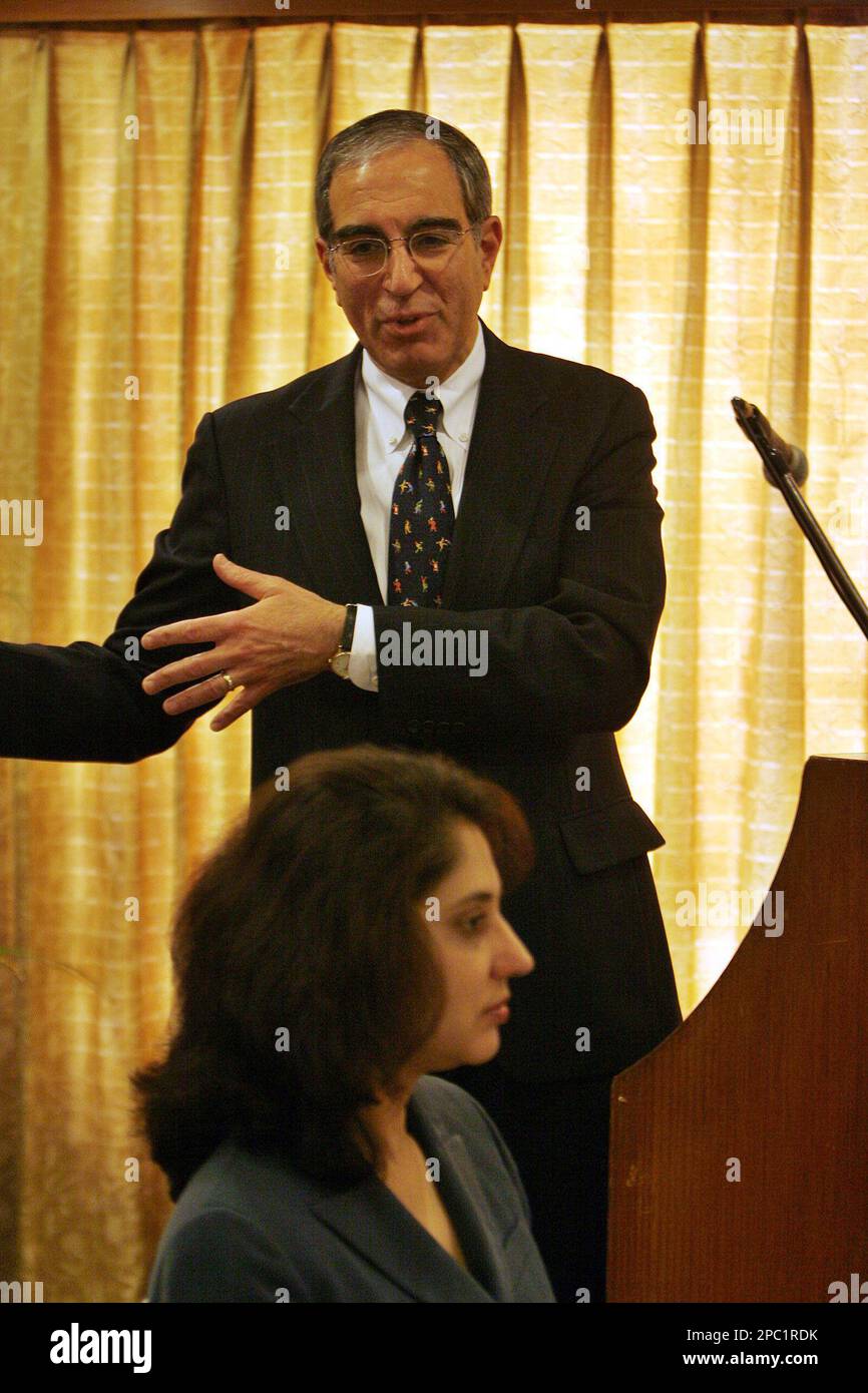 Dale Carnegie Chairman Peter Handal, standing, speaks as his colleague ...
