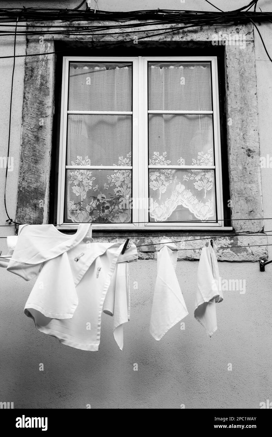 Typical Portuguese window in Lisbon with hanging clothes. Monochrome ...
