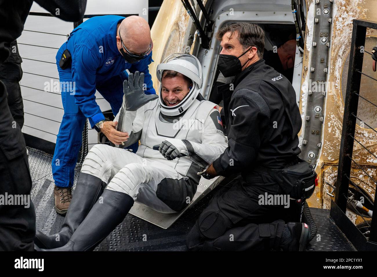 NASA Astronaut Josh Cassada waves after being helped out of the SpaceX ...