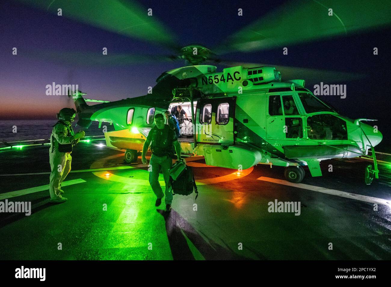 Support teams arrive via helicopter to the SpaceX recovery ship Shannon ...