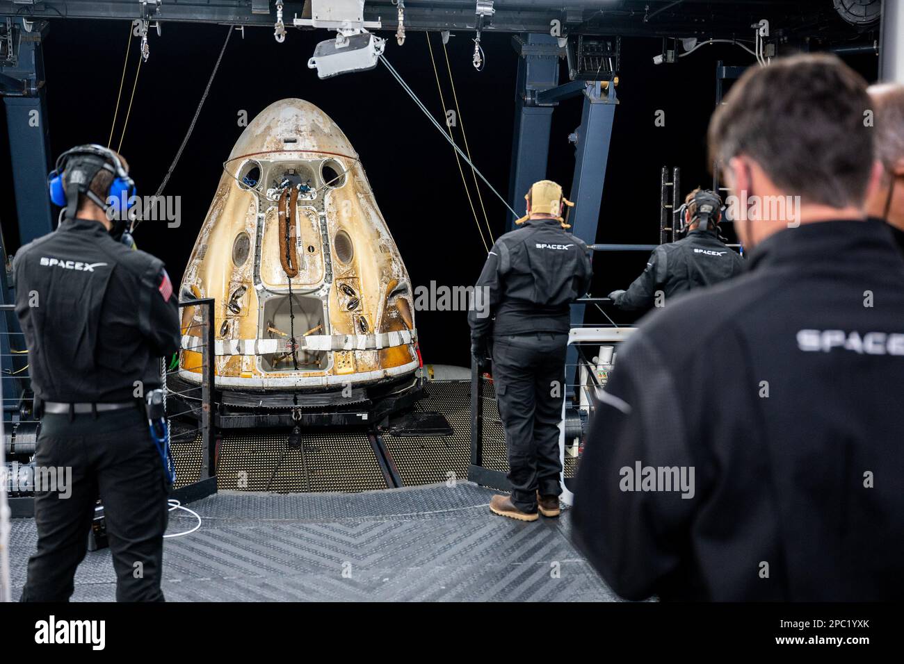 Support teams onboard the SpaceX recovery ship Shannon work around the ...