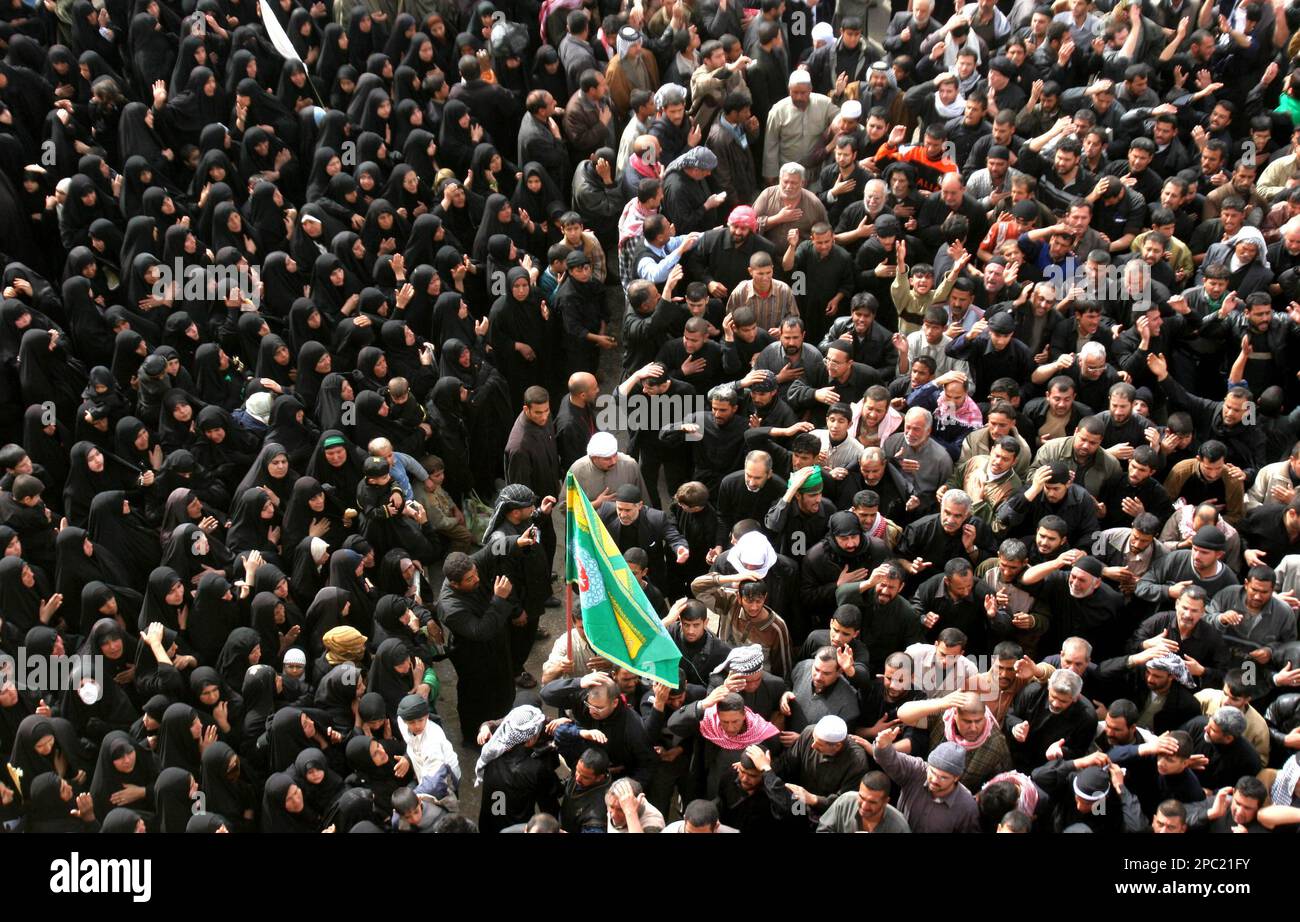 Iraqi pilgrims flock to the central square during Ashoura, the tenth ...
