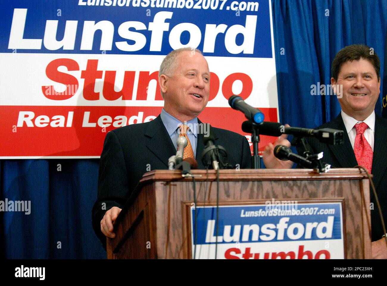 Businessman Bruce Lunsford, at podium, a Democrat, announces his ...