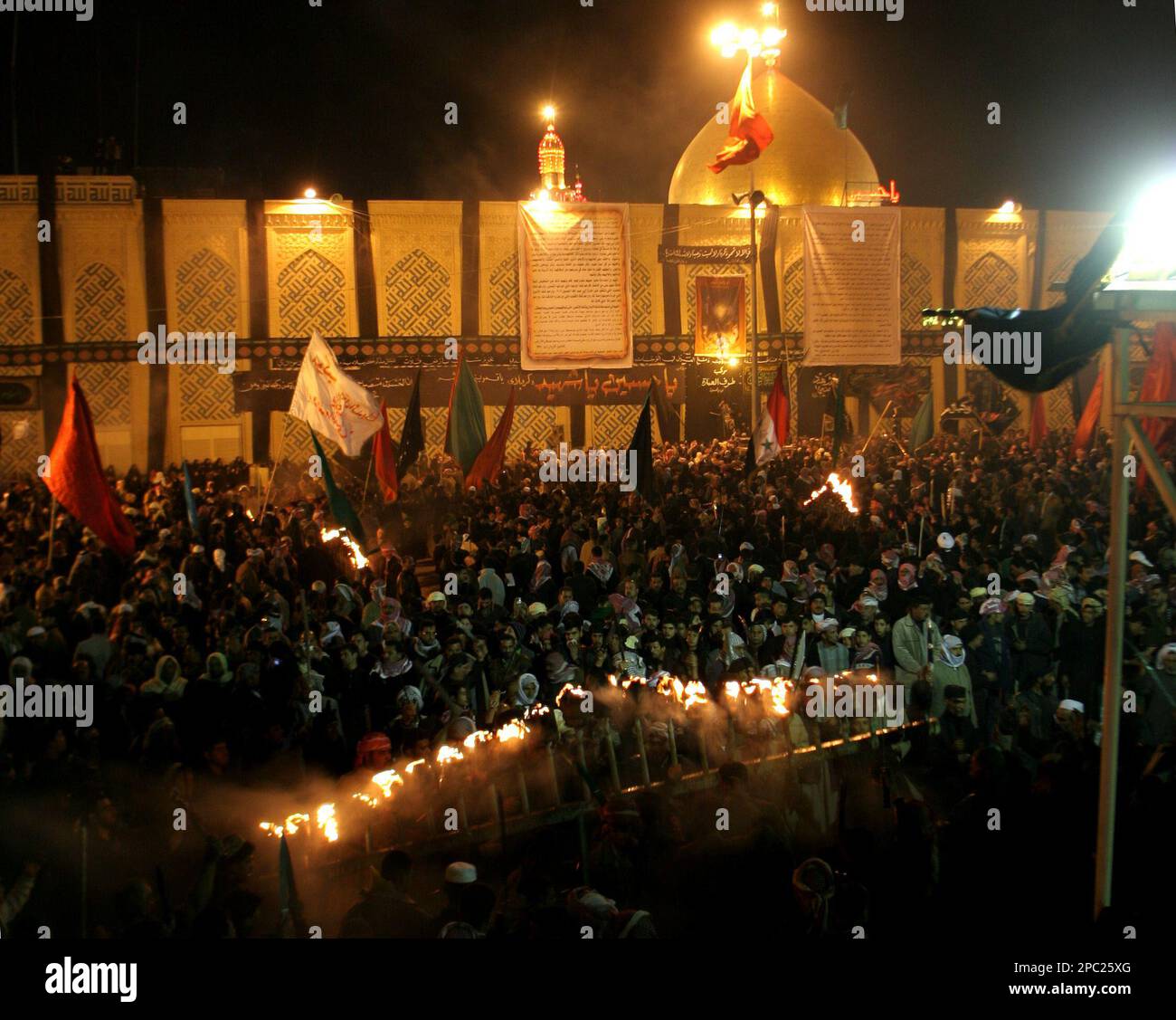 Pilgrims pray inside the holy shrine of Imam Ali during Muharram, an ...