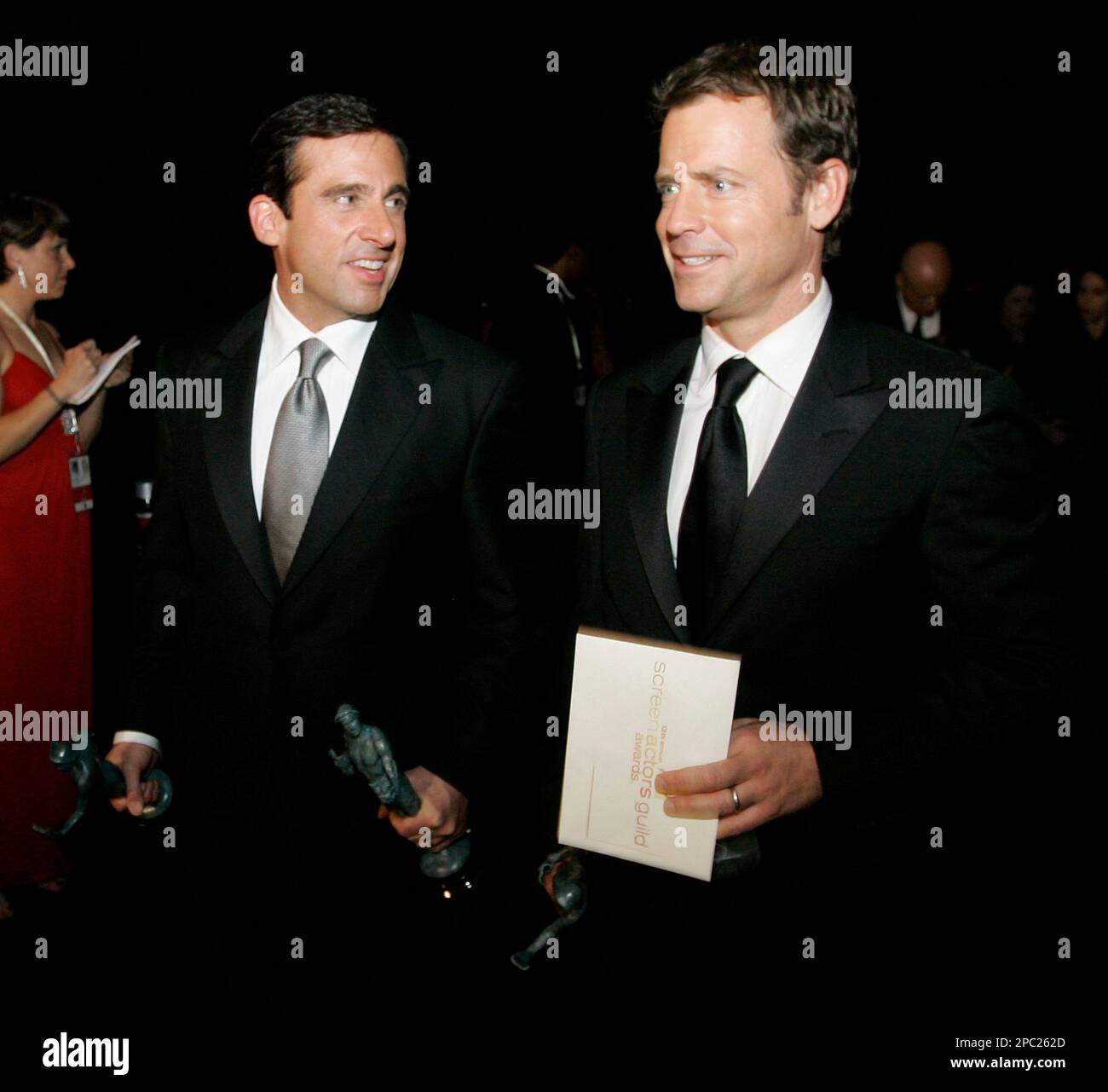 Steve Carell, left, and Greg Kinnear walk with their awards for ...