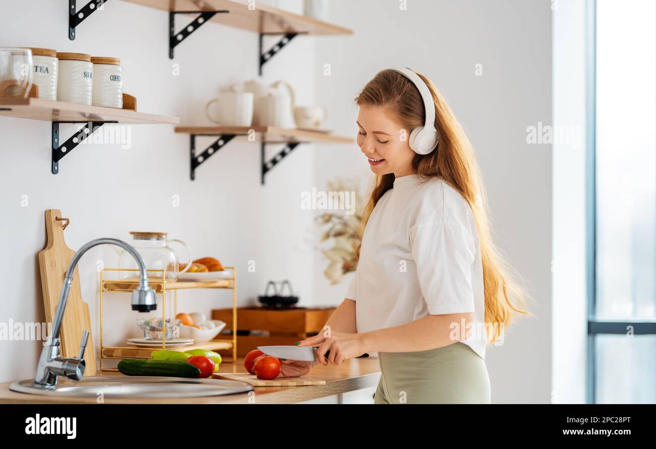 Healthy food at home. Woman is preparing the proper meal in the kitchen ...