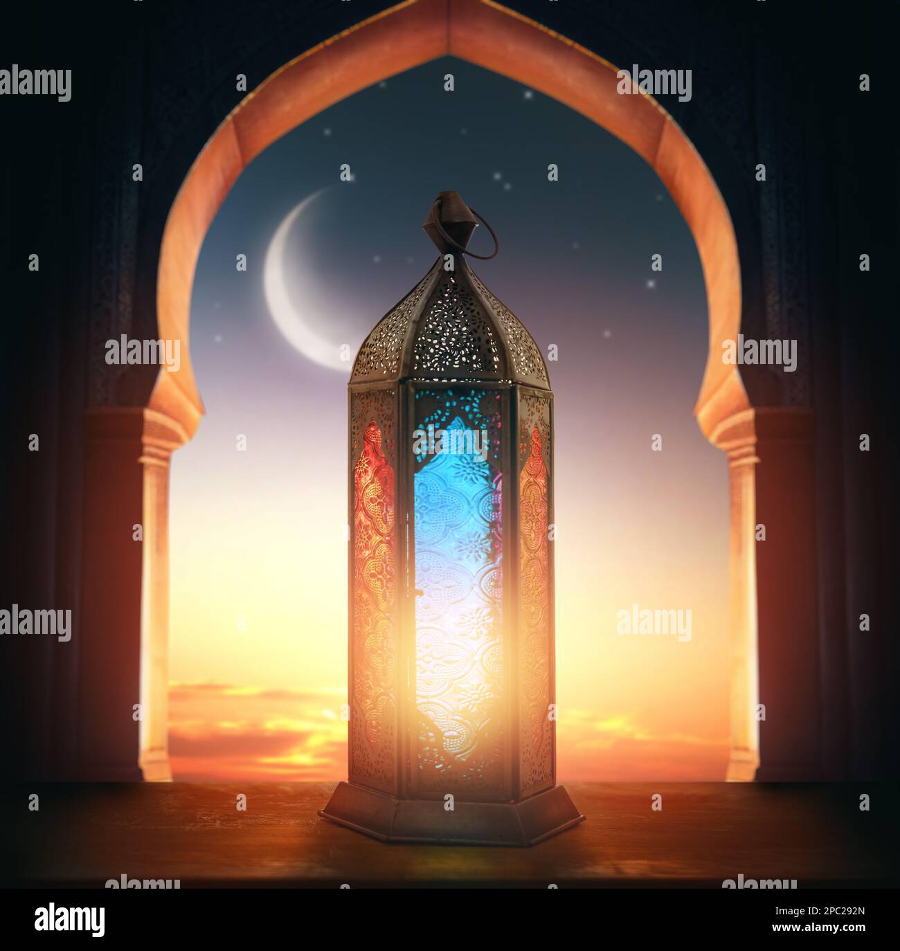 Ornamental Arabic lantern with burning candle glowing at night mosque ...