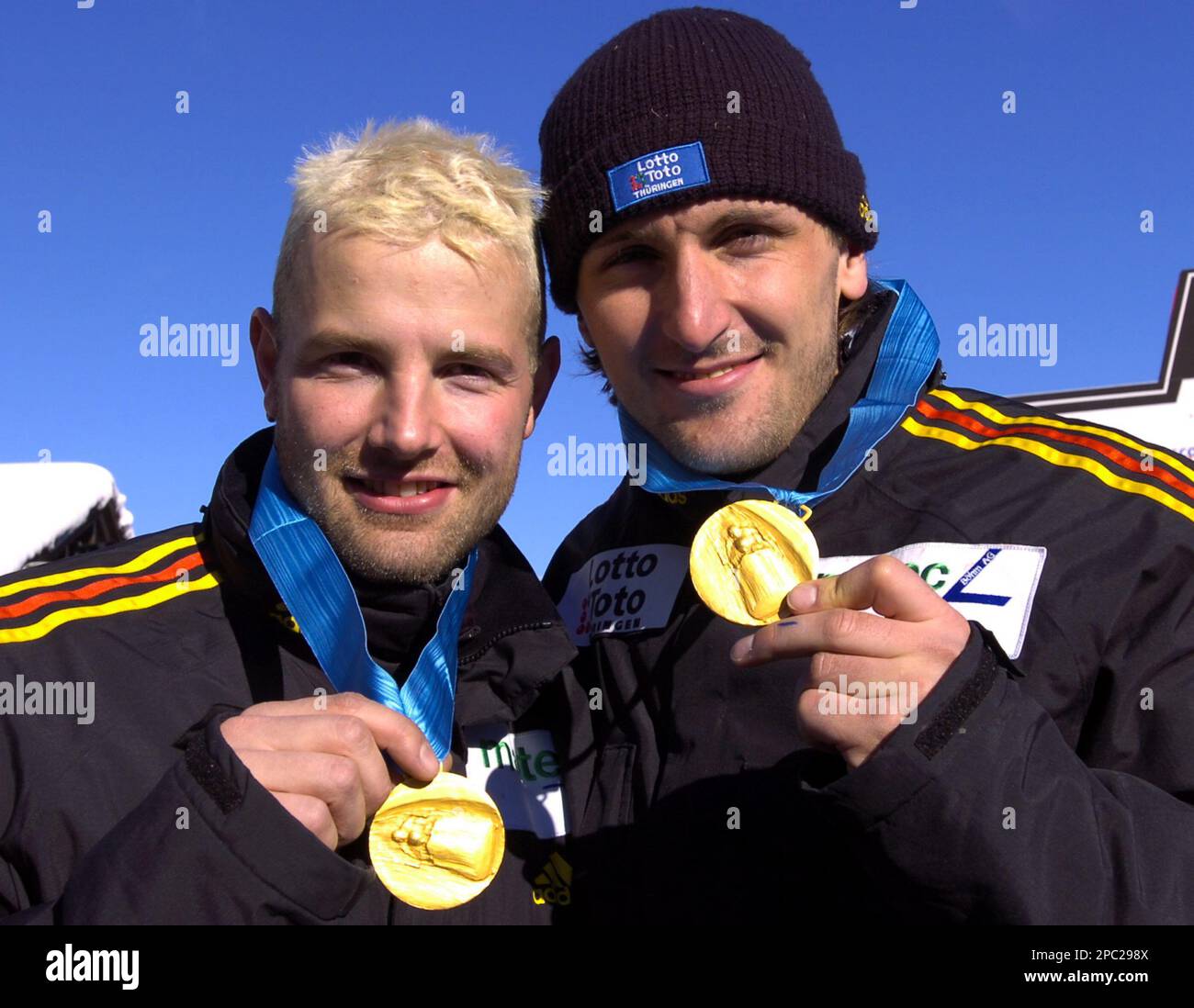 Gold medal winner Andre Lange, left, and Kevin Kuske from Germany show ...