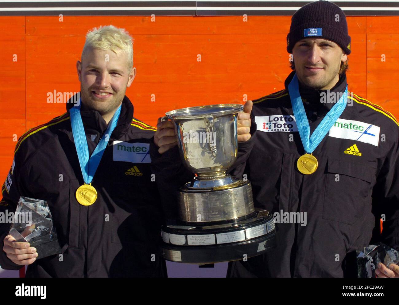Gold medal winner Andre Lange, left, and Kevin Kuske from Germany show ...