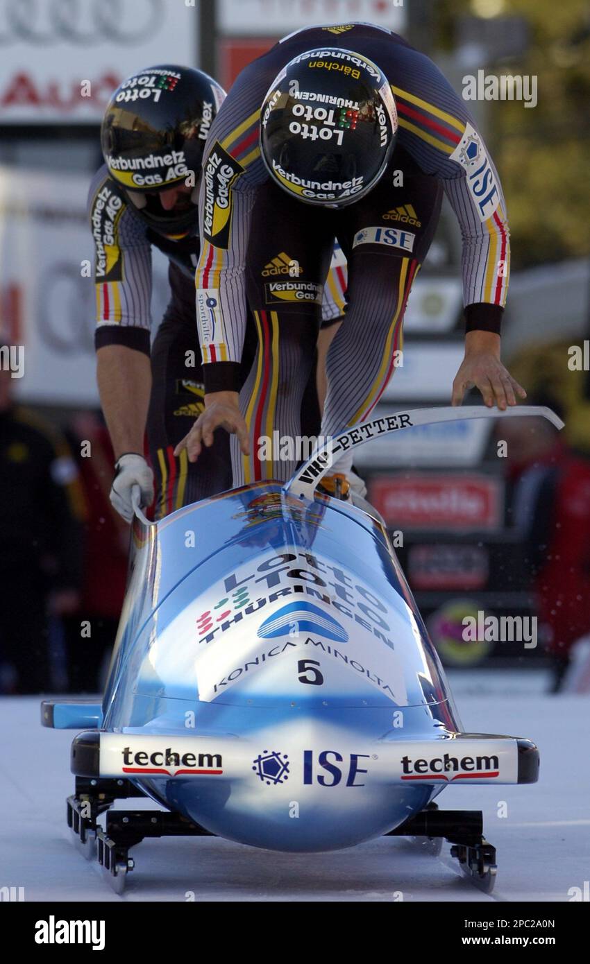 Andre Lange and Kevin Kuske from Germany start for the third run of the ...