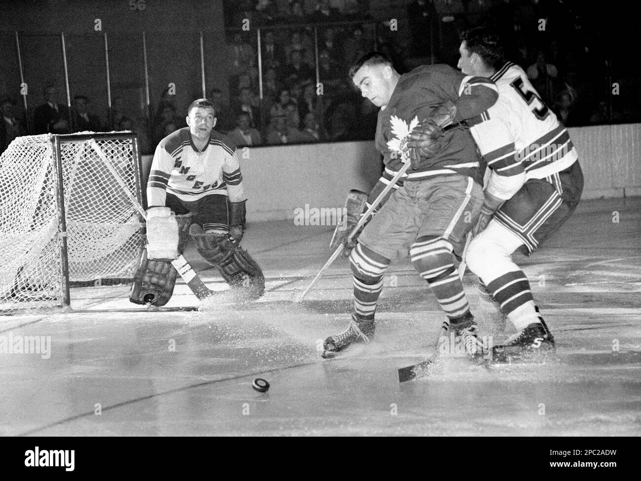 ** FILE ** Toronto Maple Leafs' forward Tod Sloan (dark uniform) and ...