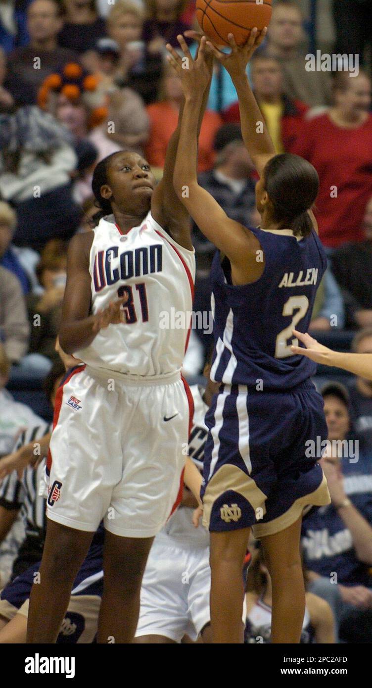 Connecticut's Tina Charles blocks a shot against Notre Dame's Charel ...