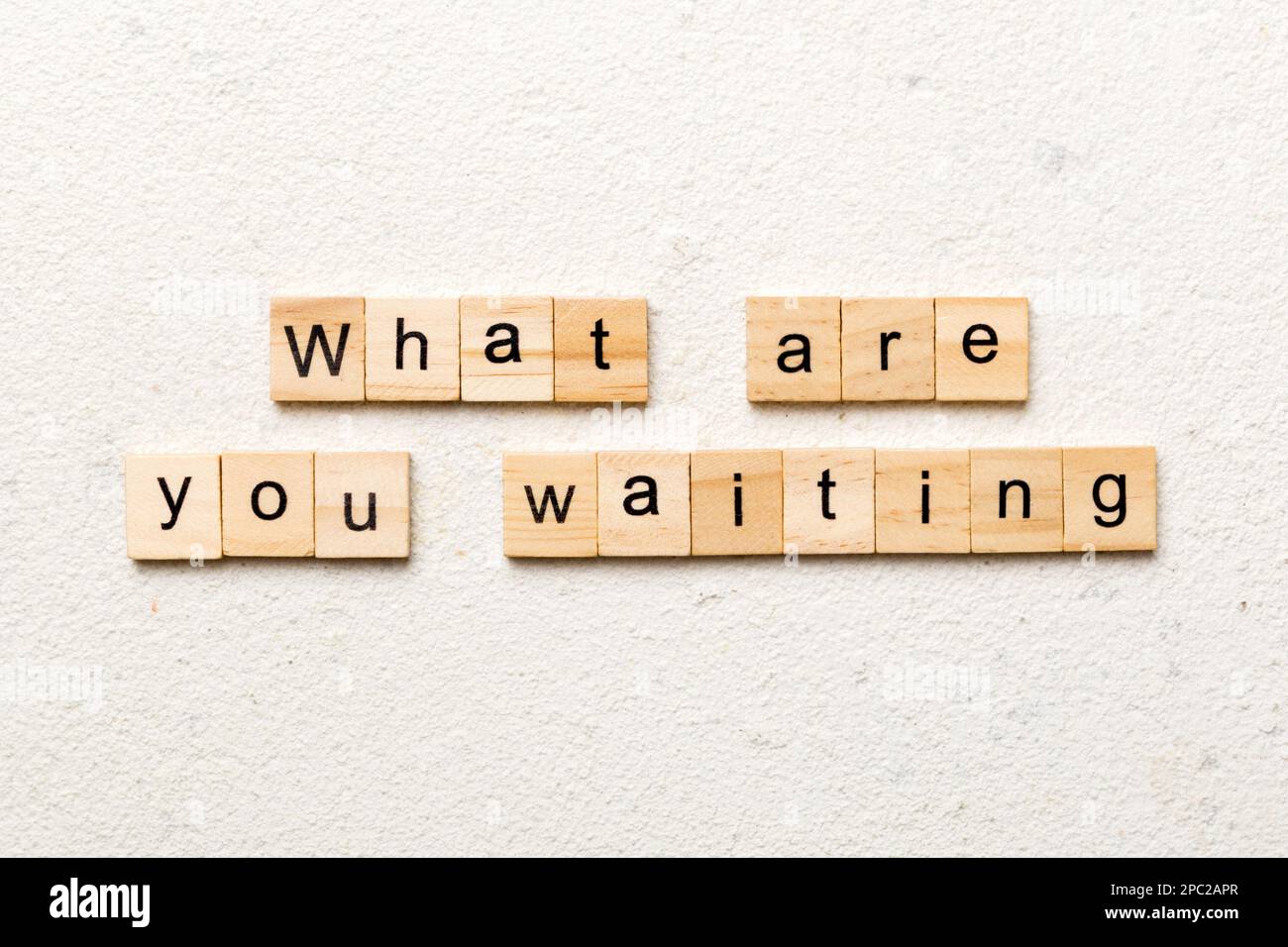 What are you waiting word written on wood block. What are you waiting ...