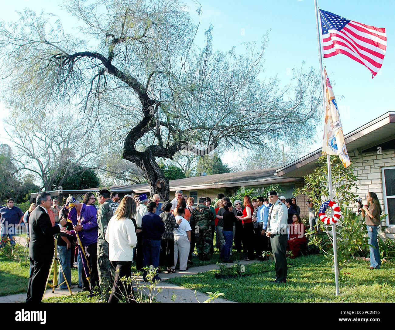 Friends and neighbors gather to show their respect to the family of ...