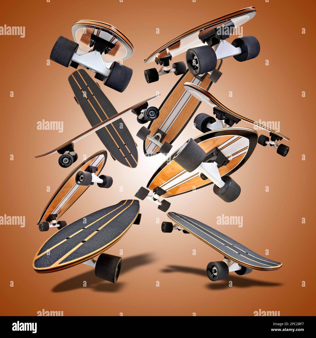 Dynamic rear view of a Black and wooden skate board isolated on a white ...