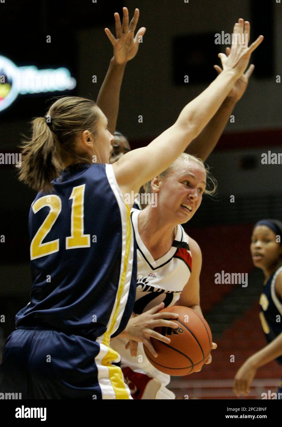Cincinnati forward Jill Stephens, right, is trapped by Marquette ...
