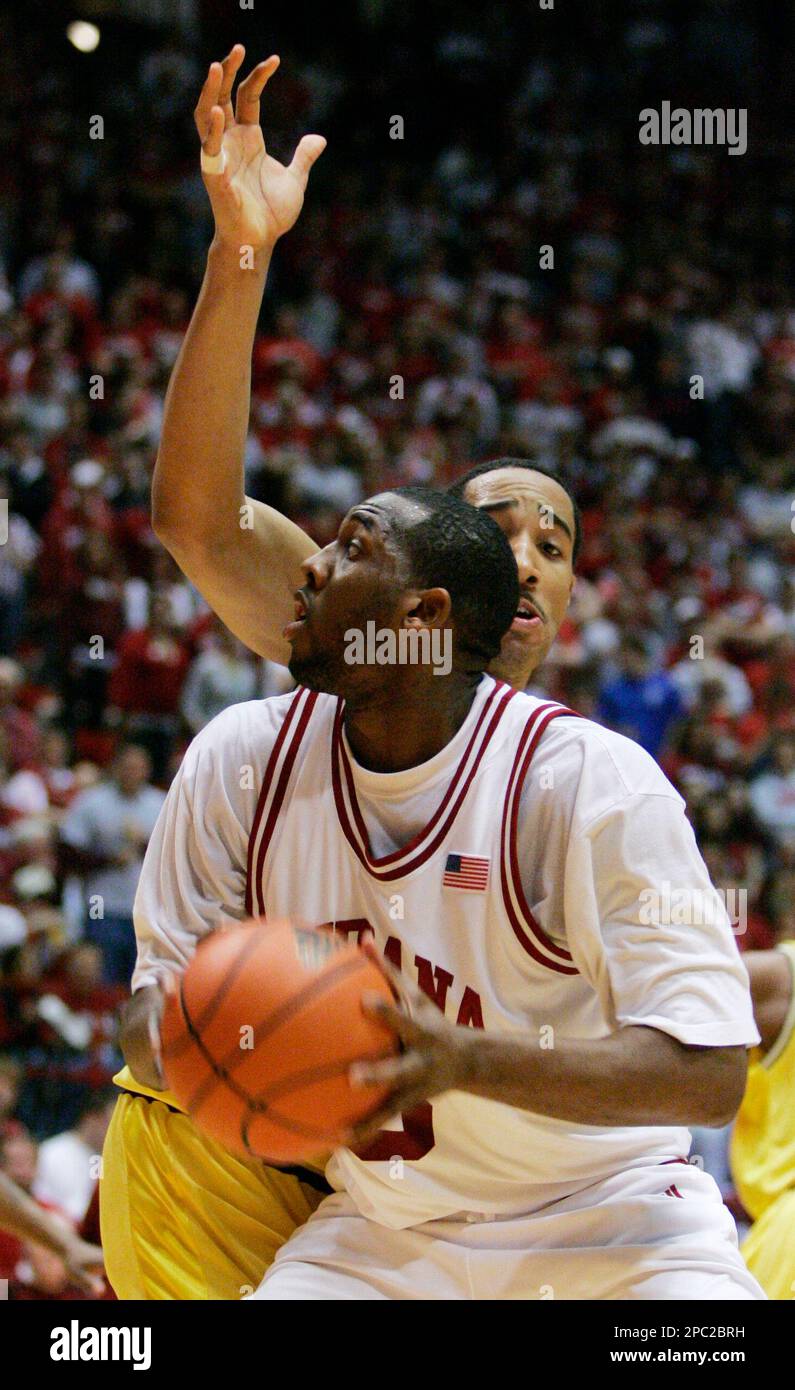Indiana forward DJ White, left, puts up a shot against Michigan center ...
