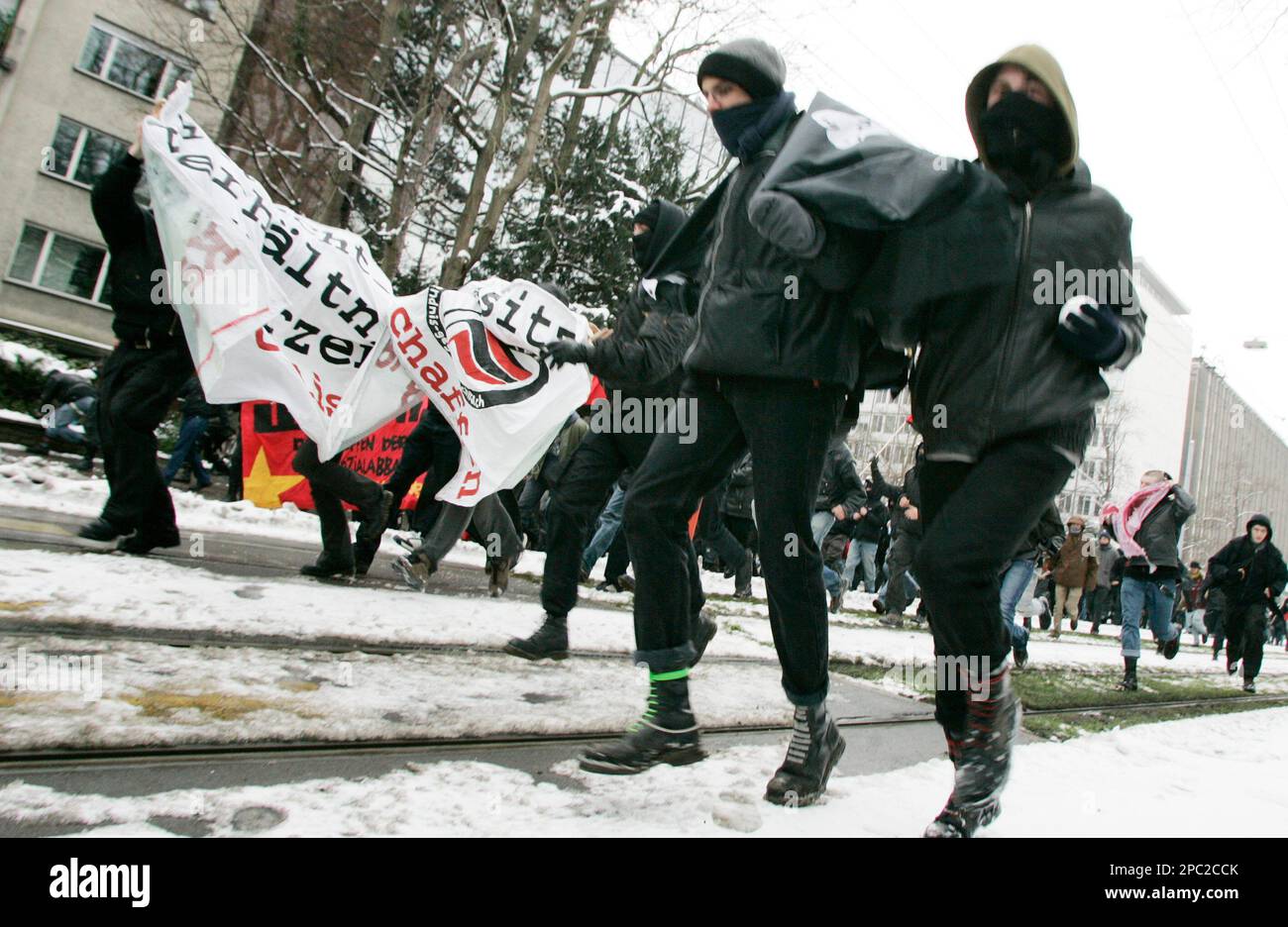 About 1000 anti-globalization activists march through Basel to protest ...