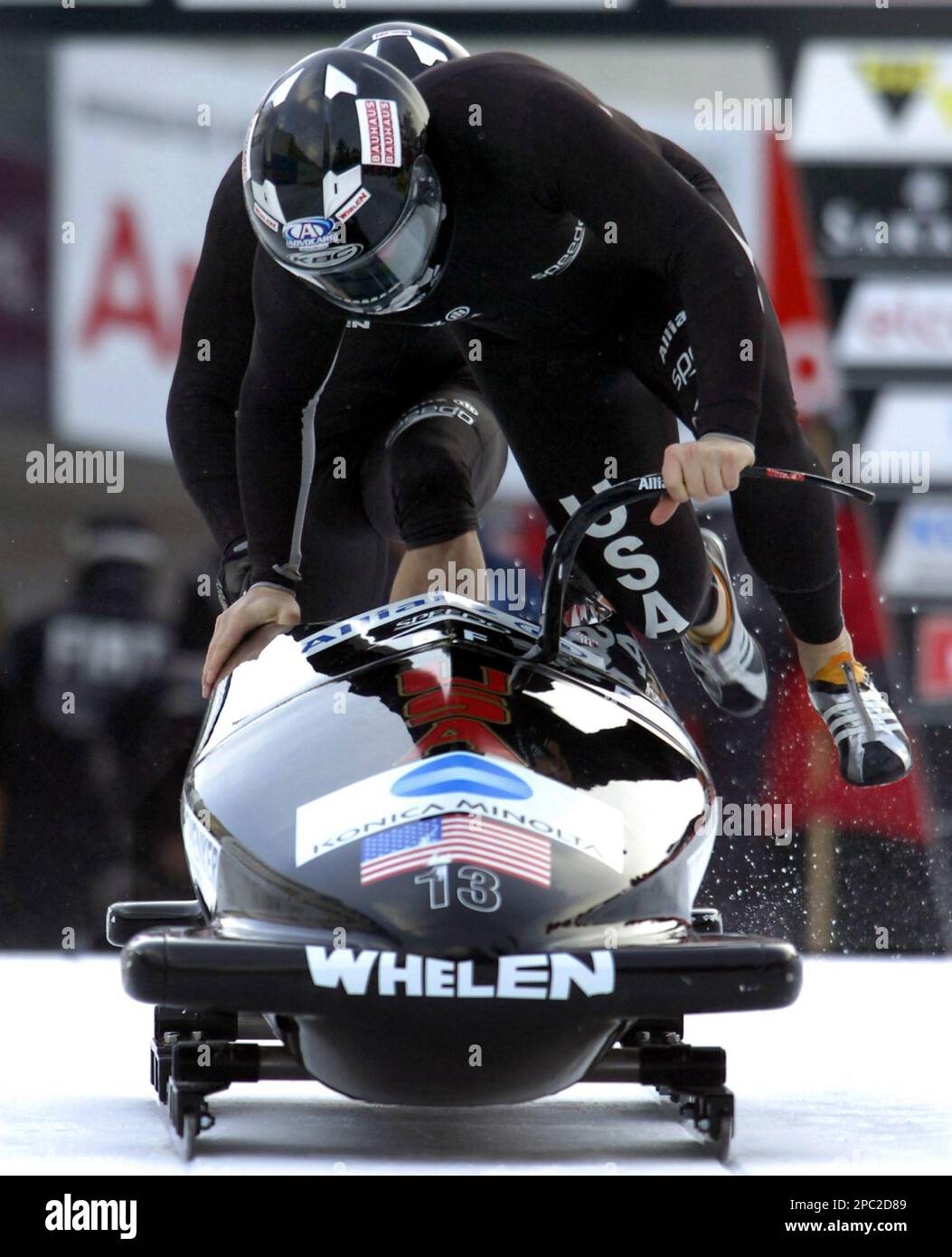 Steven Holcomb and Brock Kreitzburg from Team USA 1 start for the first ...