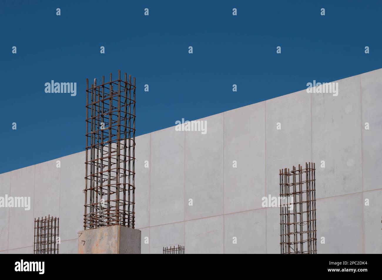 Rebar and pilings with new cement wall in Charlotte, NC Stock Photo - Alamy