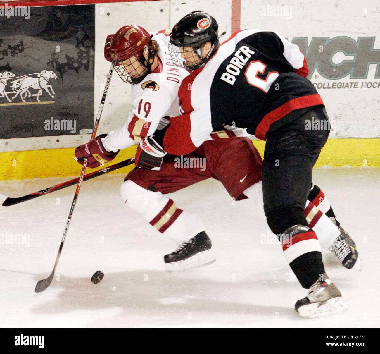 Denver center Ryan Dingle (19) and St. Cloud State defenseman Casey ...