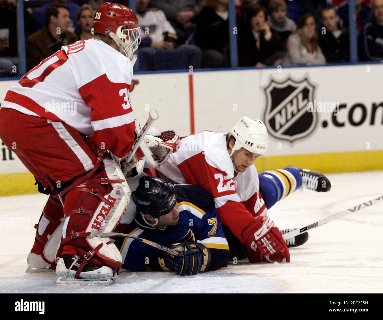 Detroit Red Wings' Brett Lebda (22) lands on top of St. Louis Blues ...