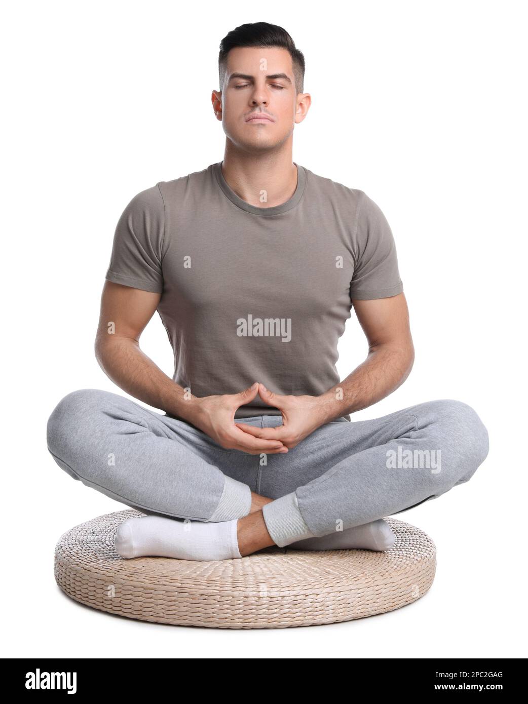 Handsome man meditating on white background. Harmony and zen Stock ...