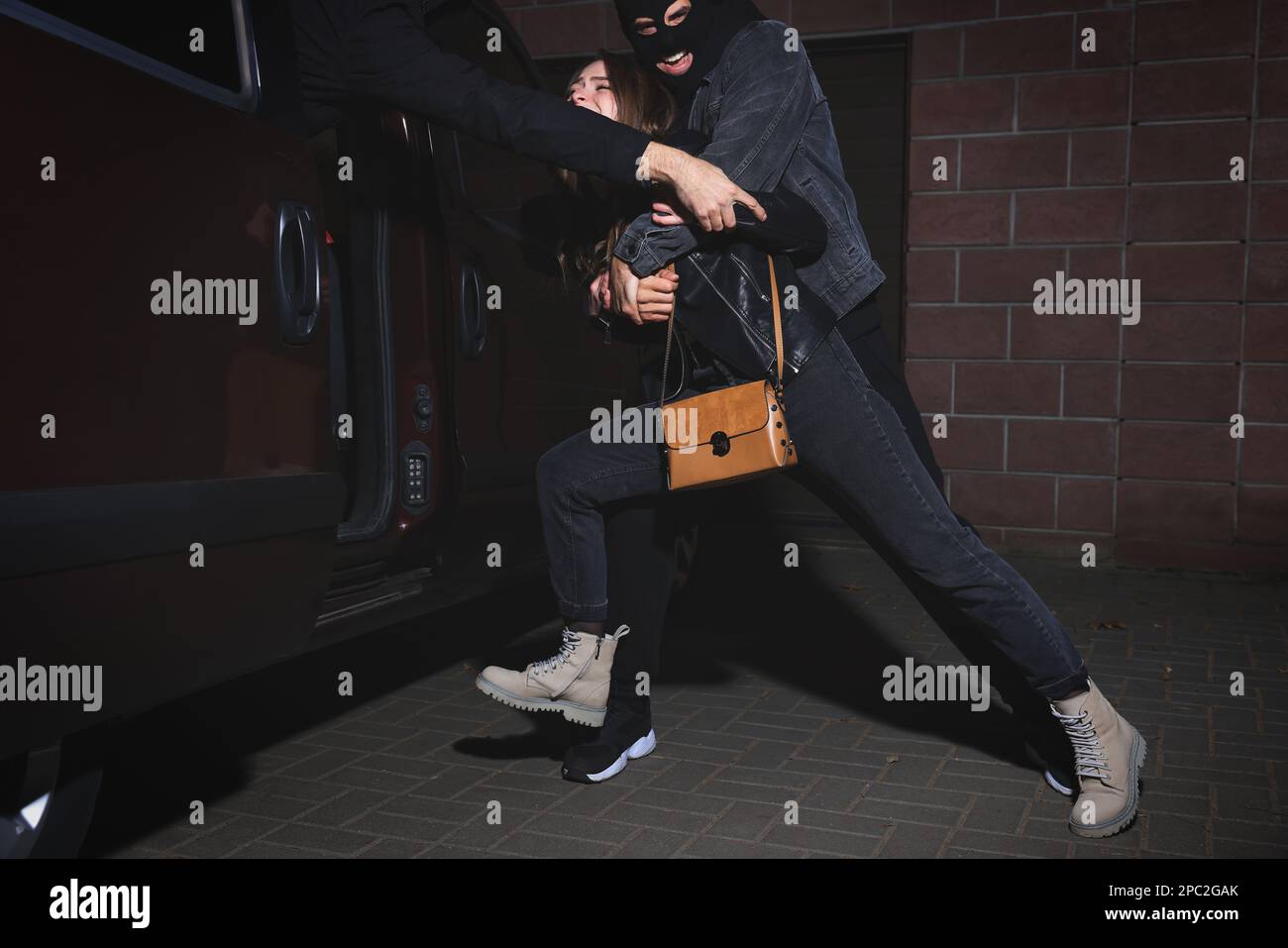Criminals kidnapping young woman at night. Self defense concept Stock ...