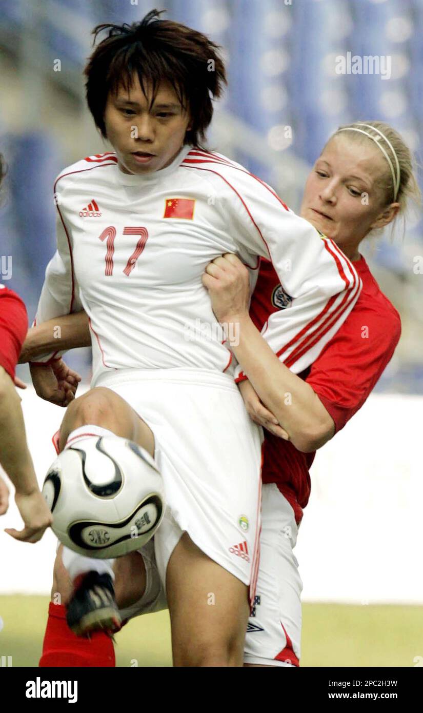 Shi Mengyu of China, front, and Katie Chapman of England, back, fight ...