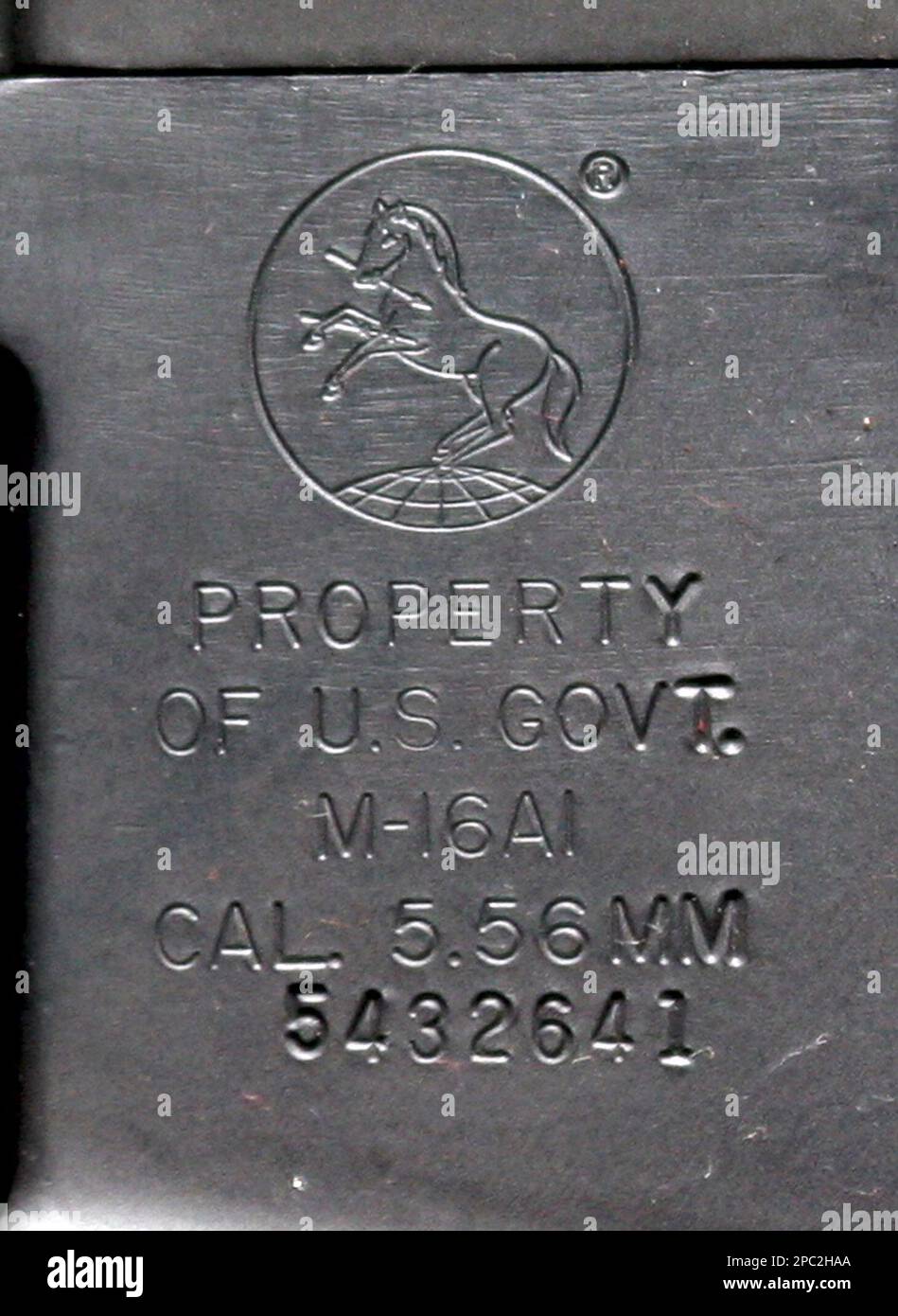 A detail of the military identification stamped on the side of a Colt M ...