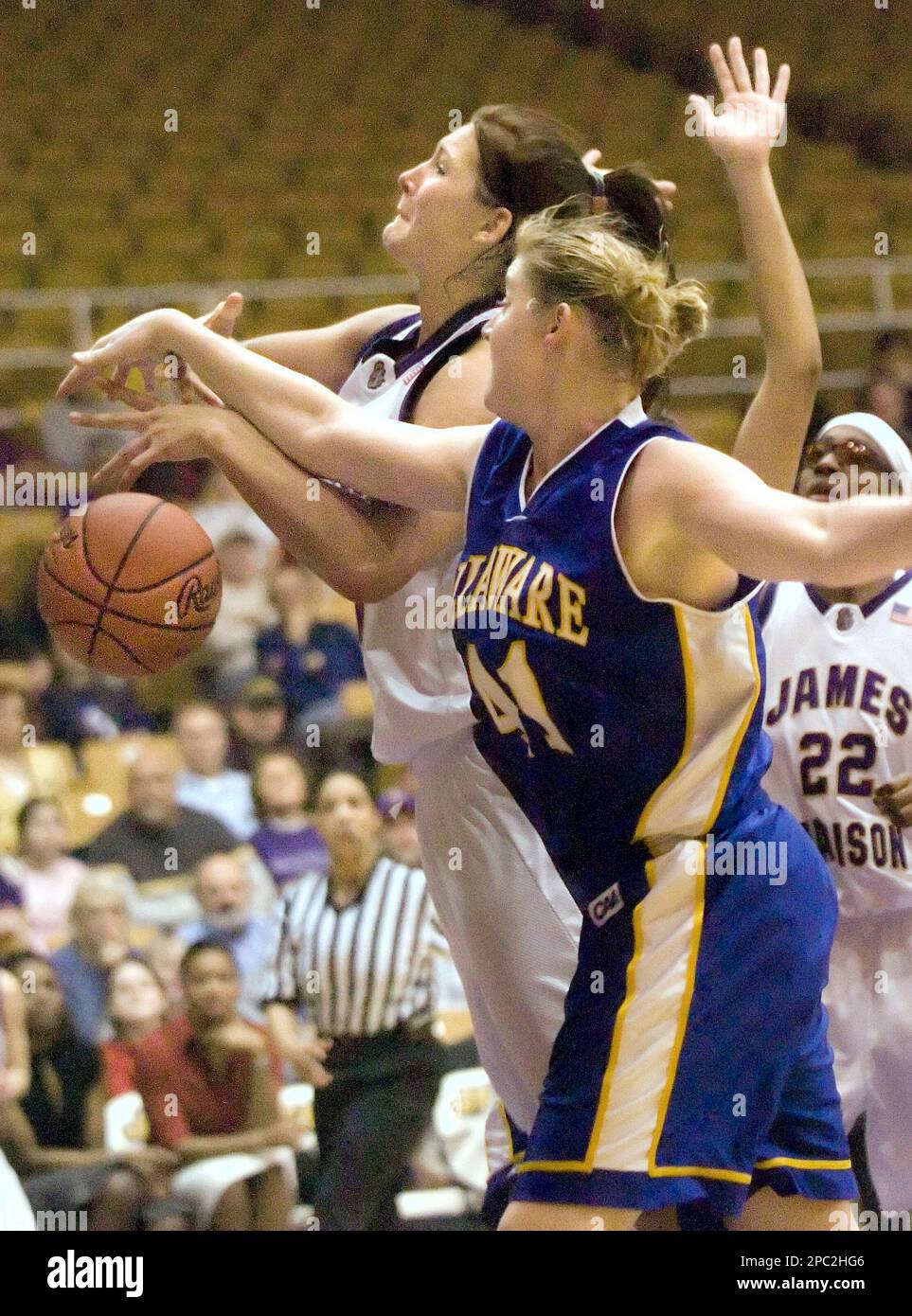 James Madison's Meredith Alexis collides with Delaware's Chrissy Fisher ...
