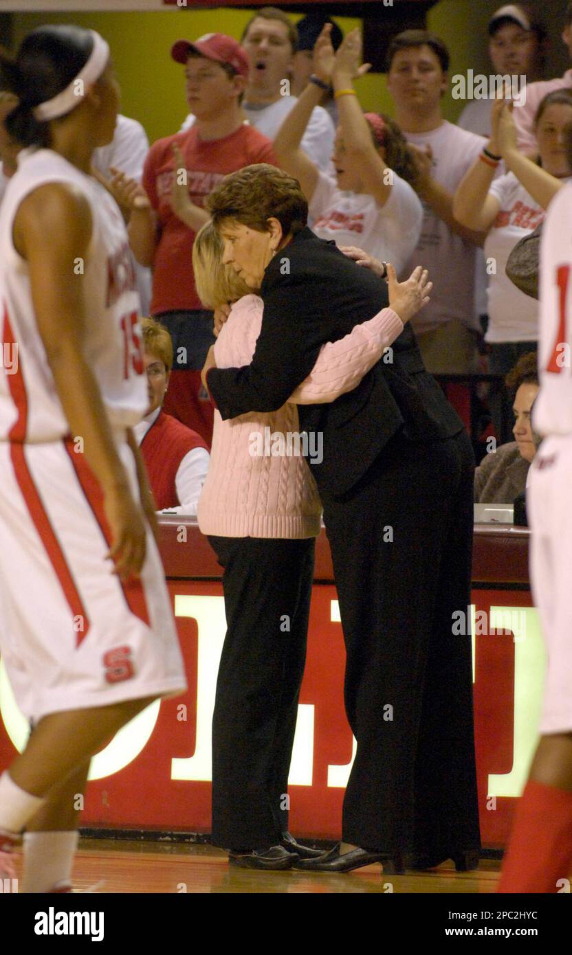 North Carolina State coach Kay Yow, right, gets a hug from Virginia ...