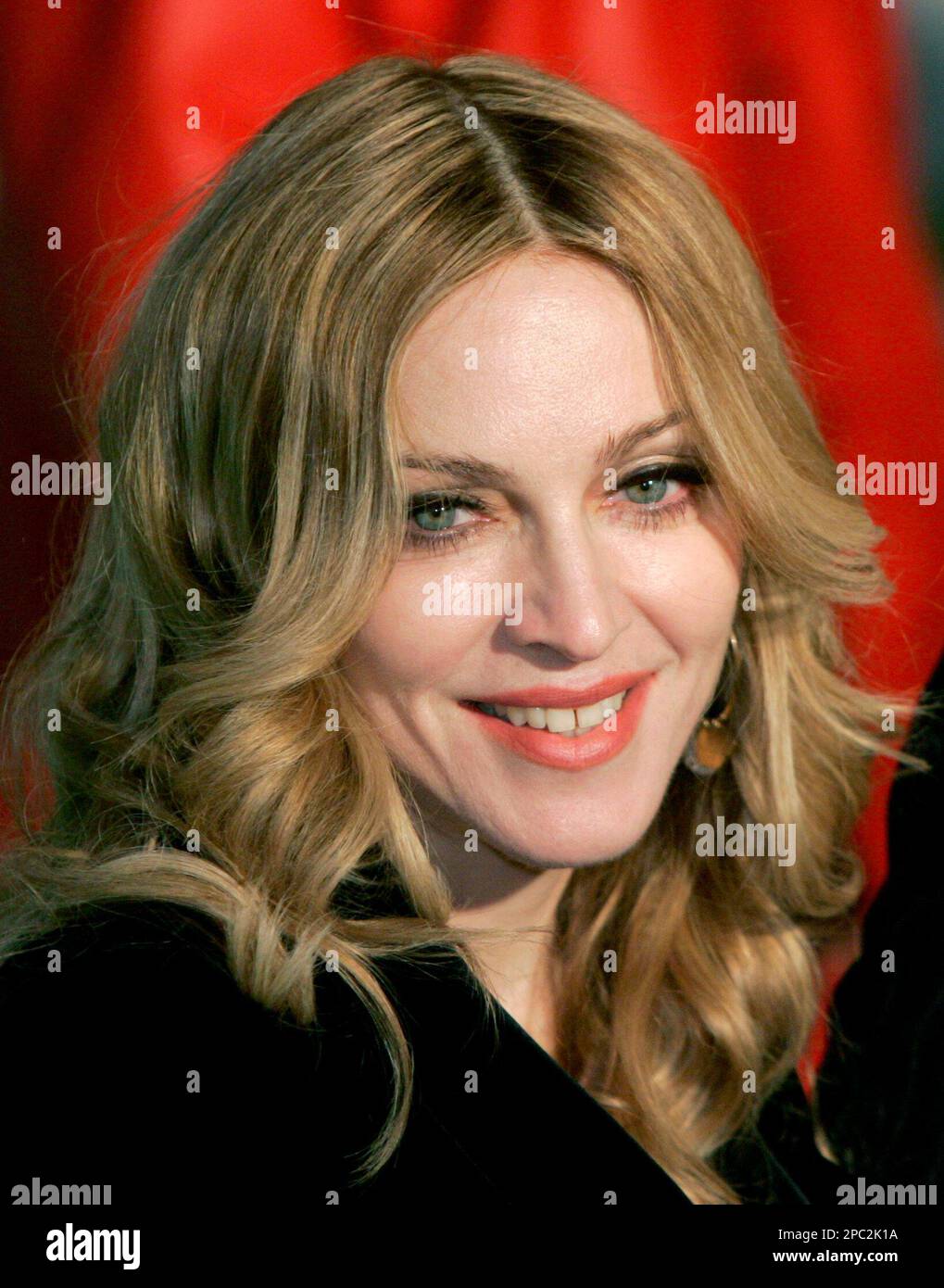Cast member U.S. singer Madonna poses for photographers as she arrives ...