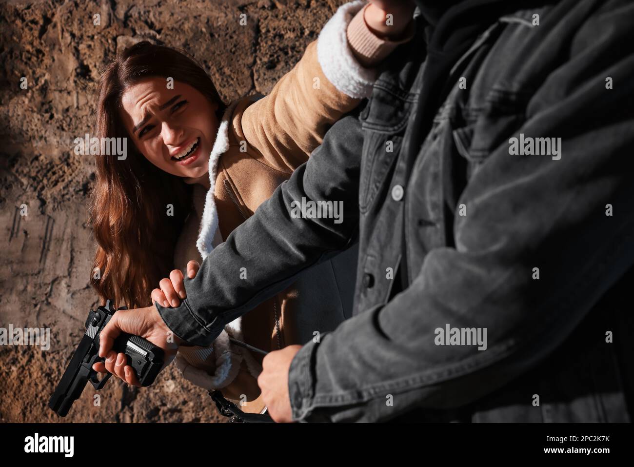 Woman fighting with armed thief while he trying to steal her bag in ...
