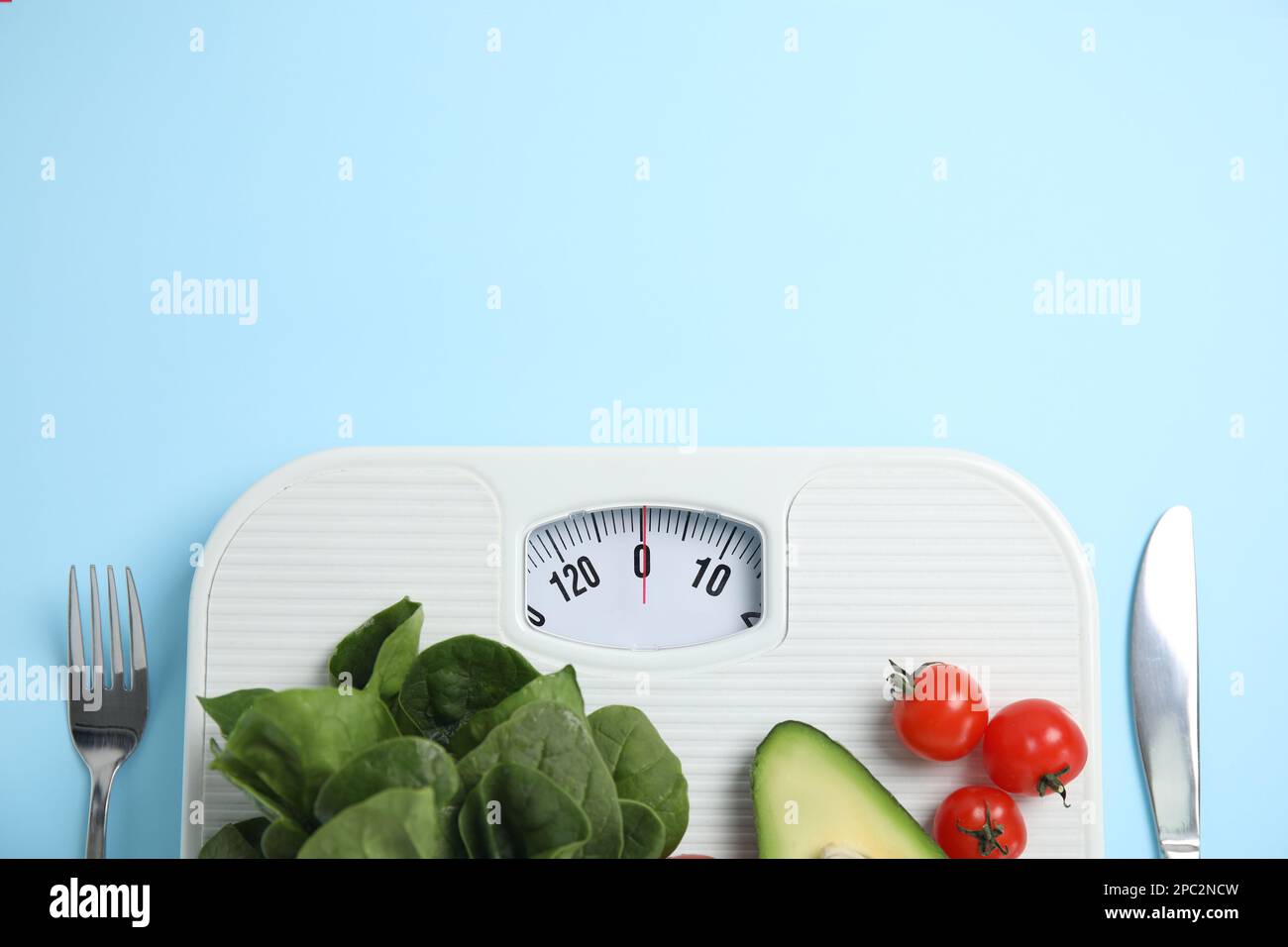 Scales, healthy food and cutlery on light blue background, flat lay ...