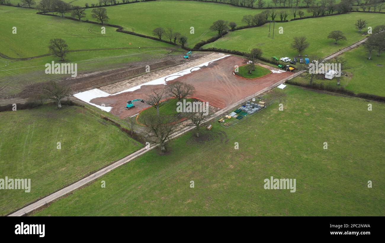 An aerial view of an active construction site with workers and ...