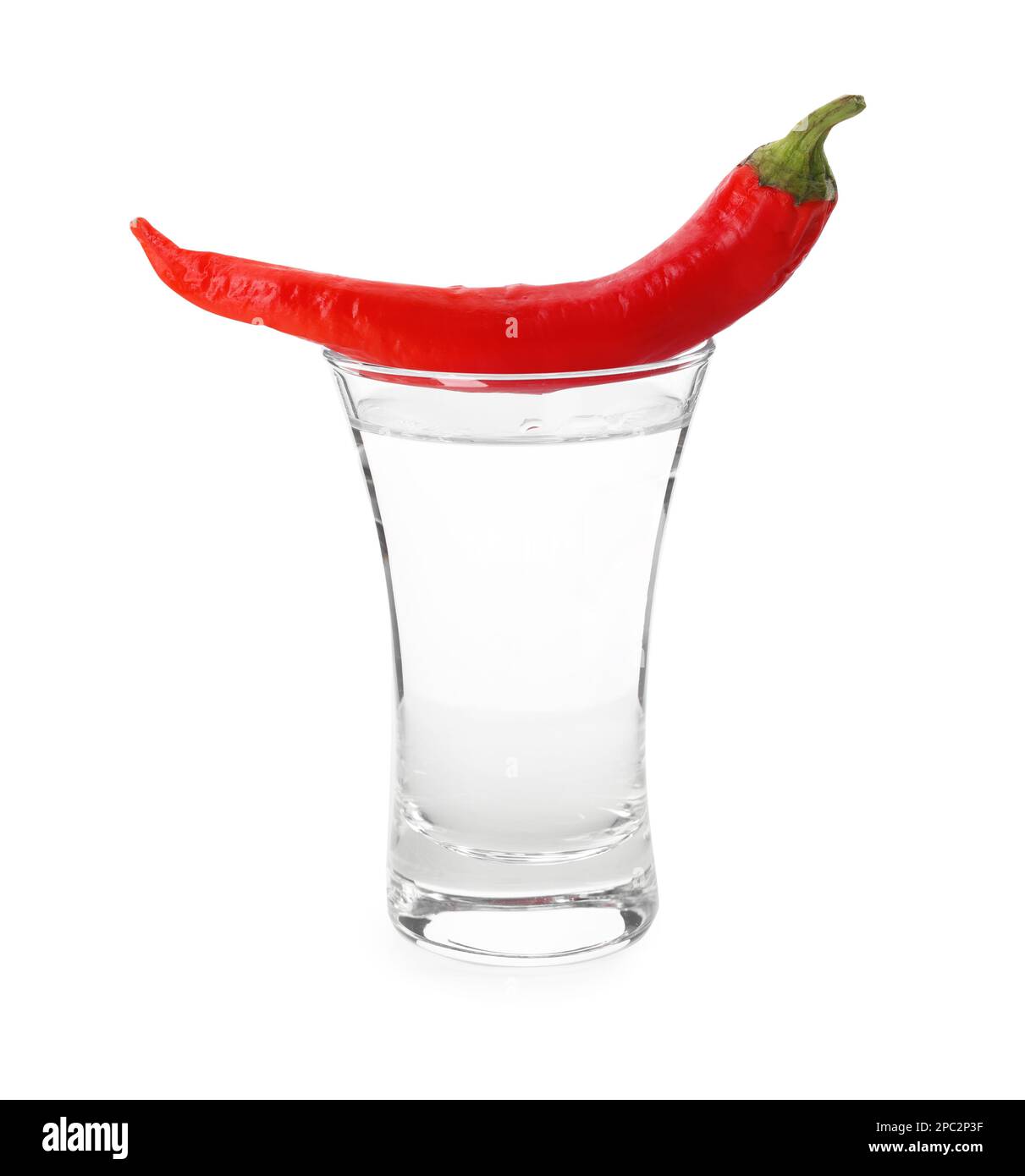 Red hot chili pepper and vodka in shot glass on white background Stock ...