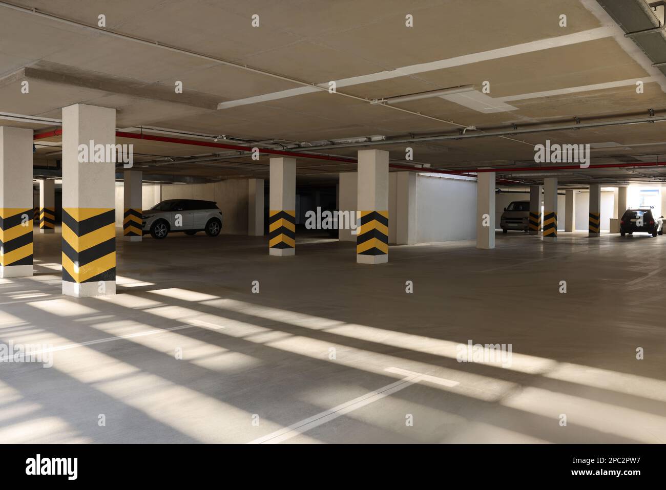 Open parking garage with cars on sunny day Stock Photo - Alamy