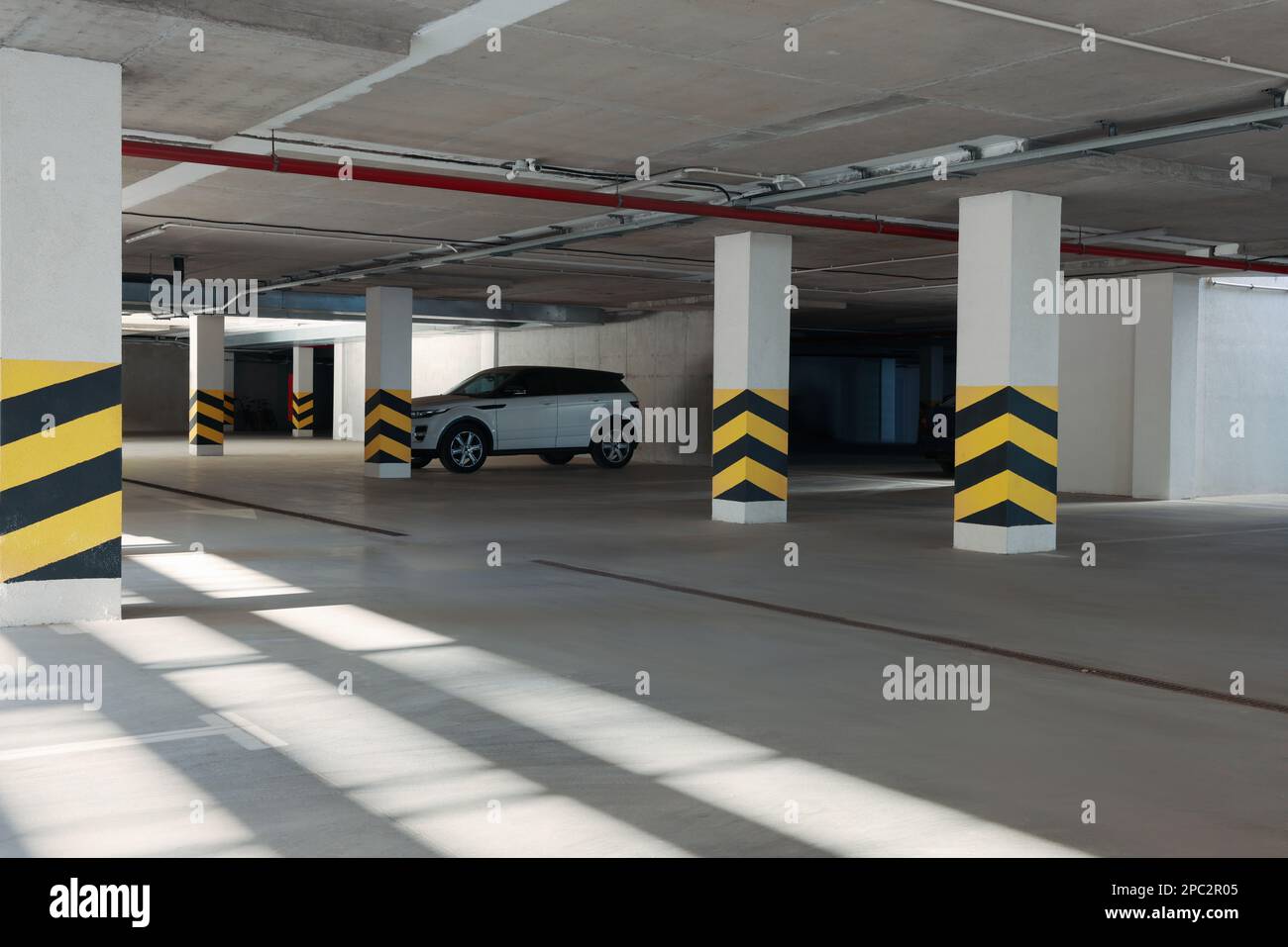 Open parking garage with car on sunny day Stock Photo - Alamy