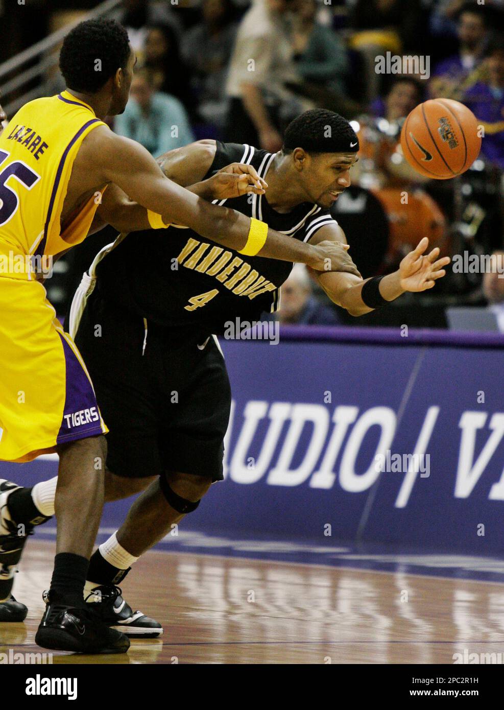 Louisiana State forward Darnell Lazare, left, fouls Vanderbilt guard ...