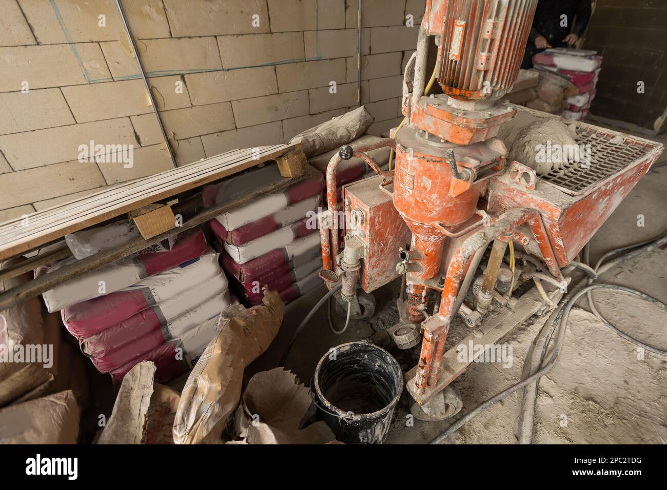 A specialized mixer for mixing dry plaster with water and automatically ...