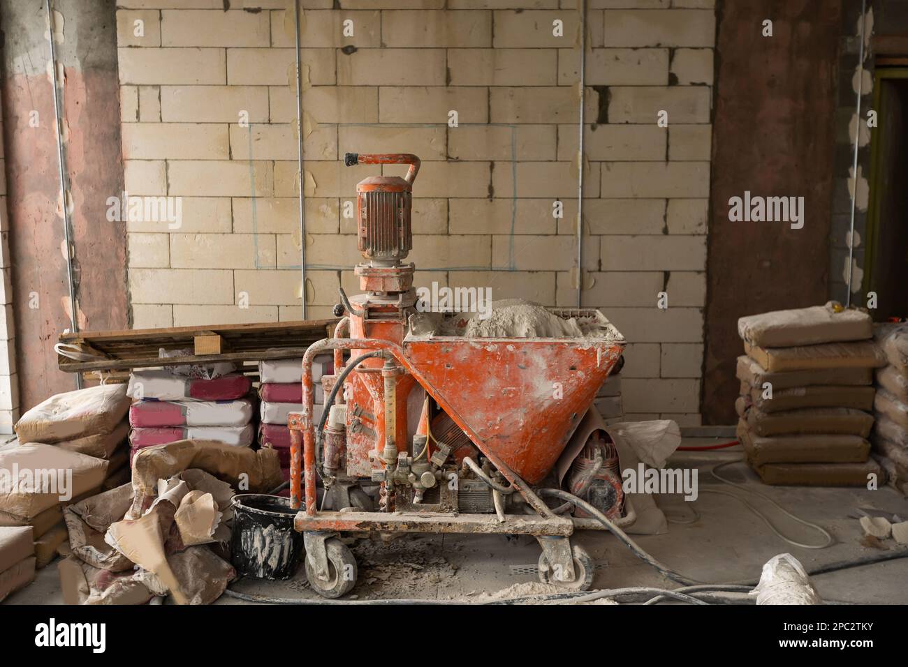 A specialized mixer for mixing dry plaster with water and automatically ...