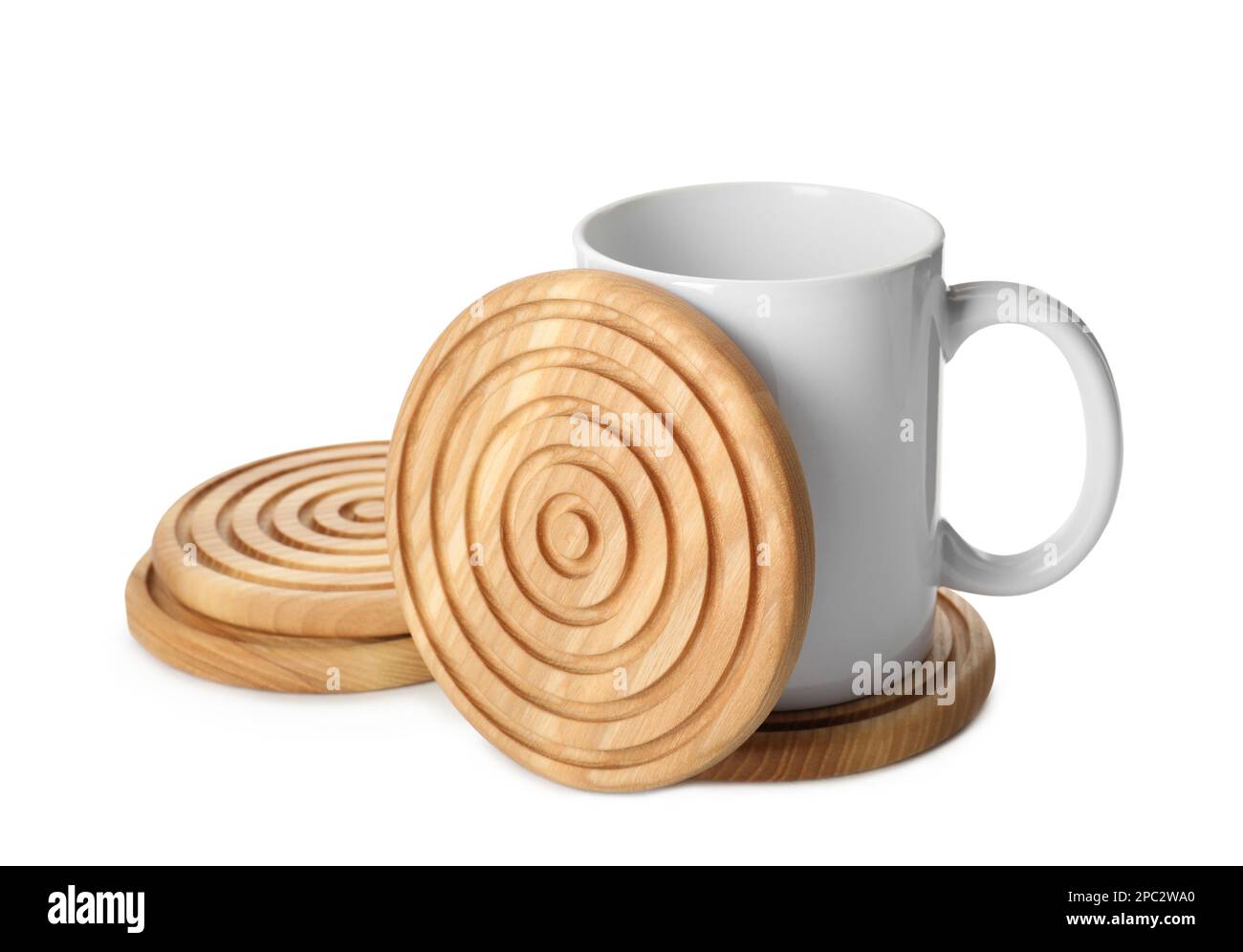 Mug and stylish wooden coasters on white background Stock Photo - Alamy
