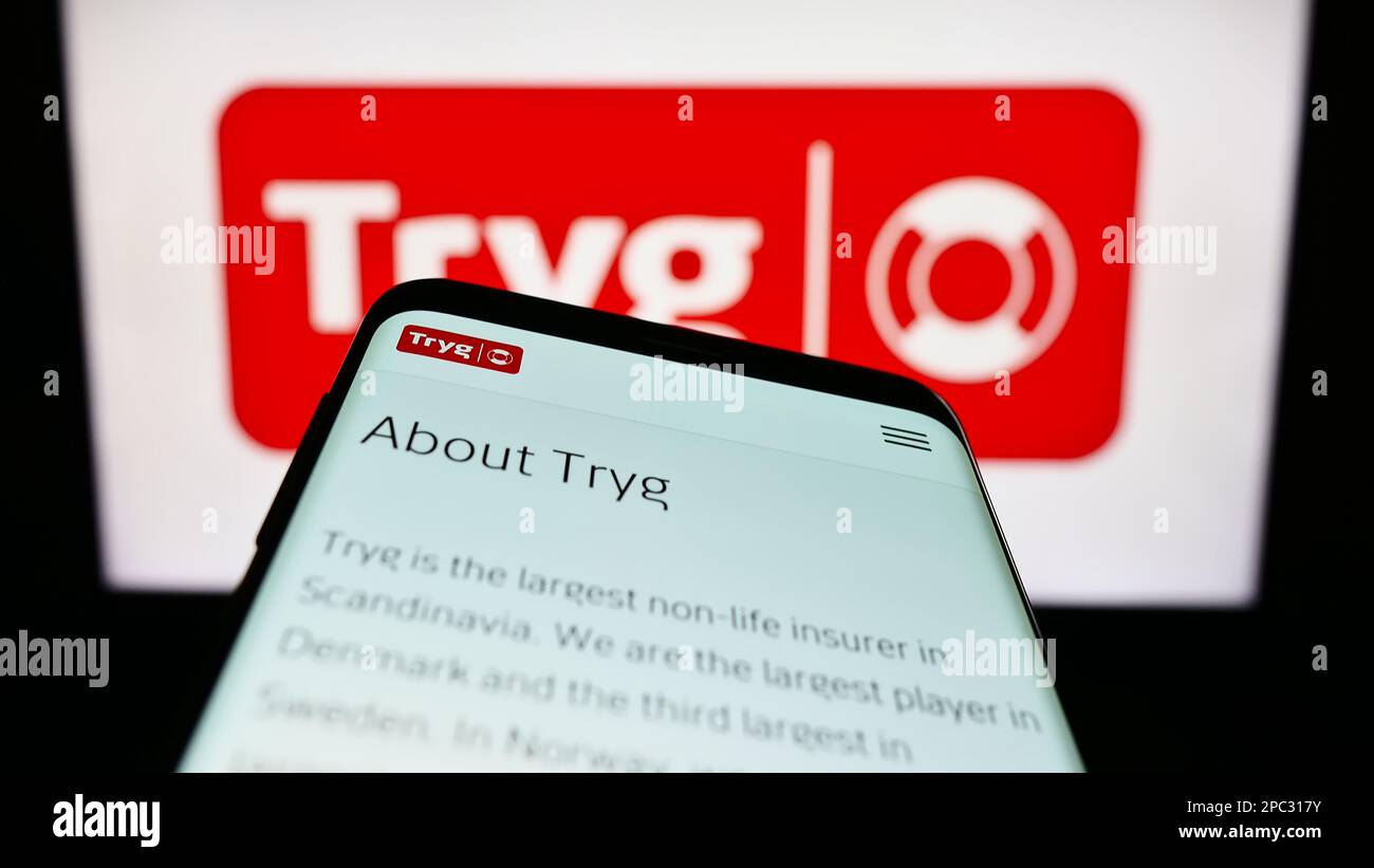 Smartphone with webpage of Danish insurance company Tryg Forsikring AS ...
