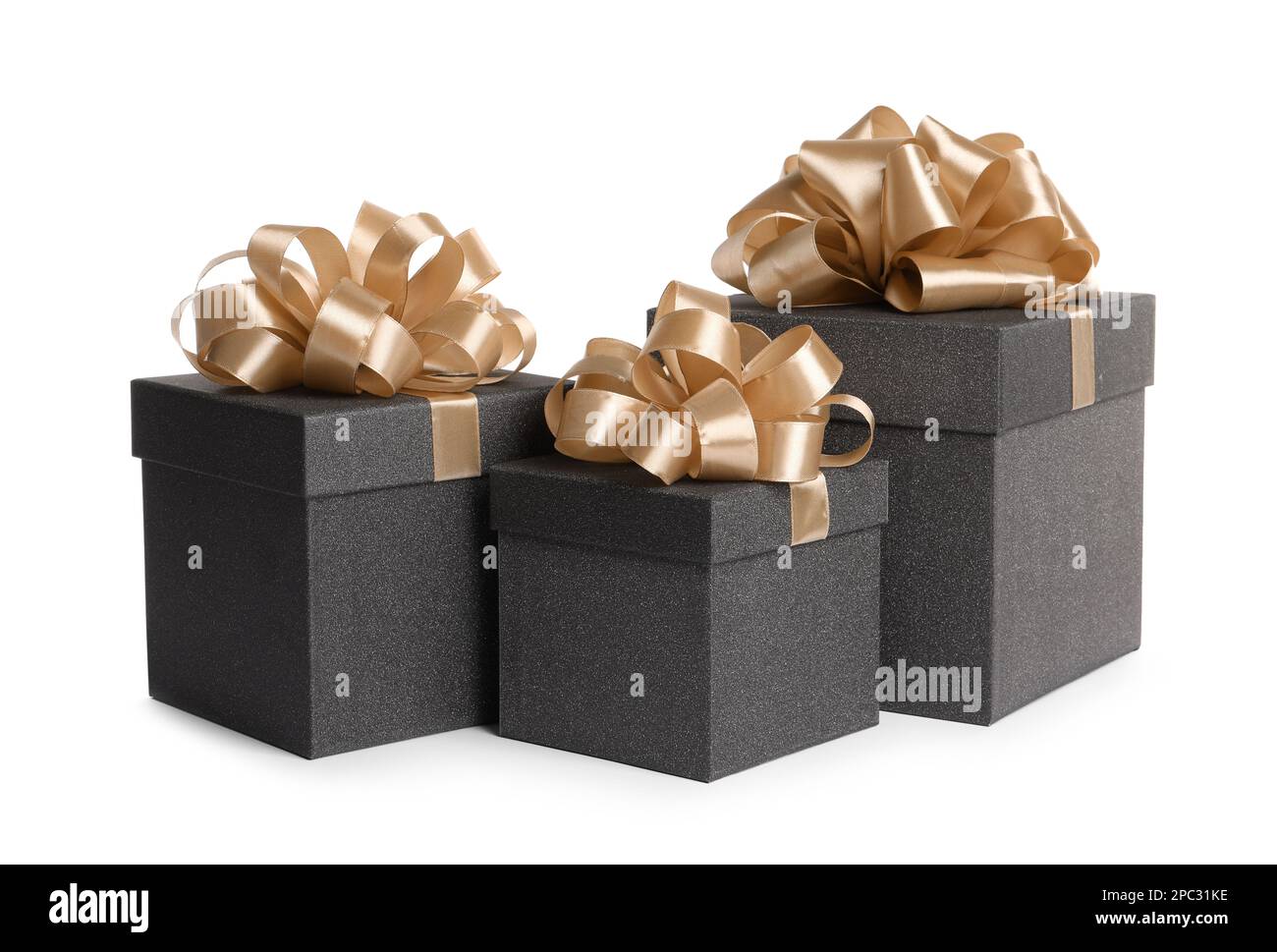 Black gift boxes with golden bows on white background Stock Photo - Alamy