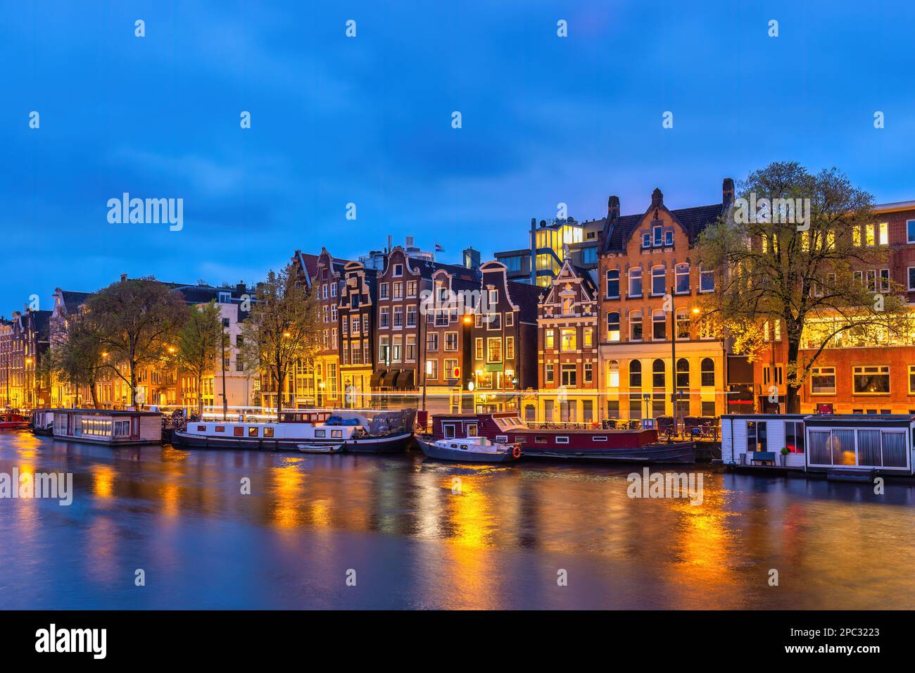 Amsterdam Netherlands, night city skyline at canal waterfront Stock ...