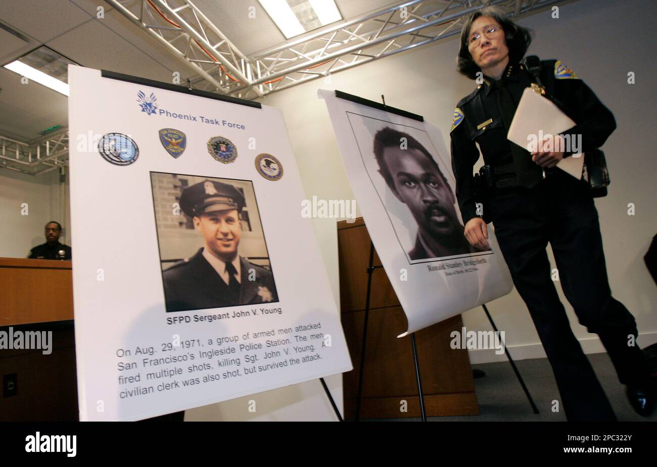 San Francisco Police Chief Heather Fong walks to a news conference past ...