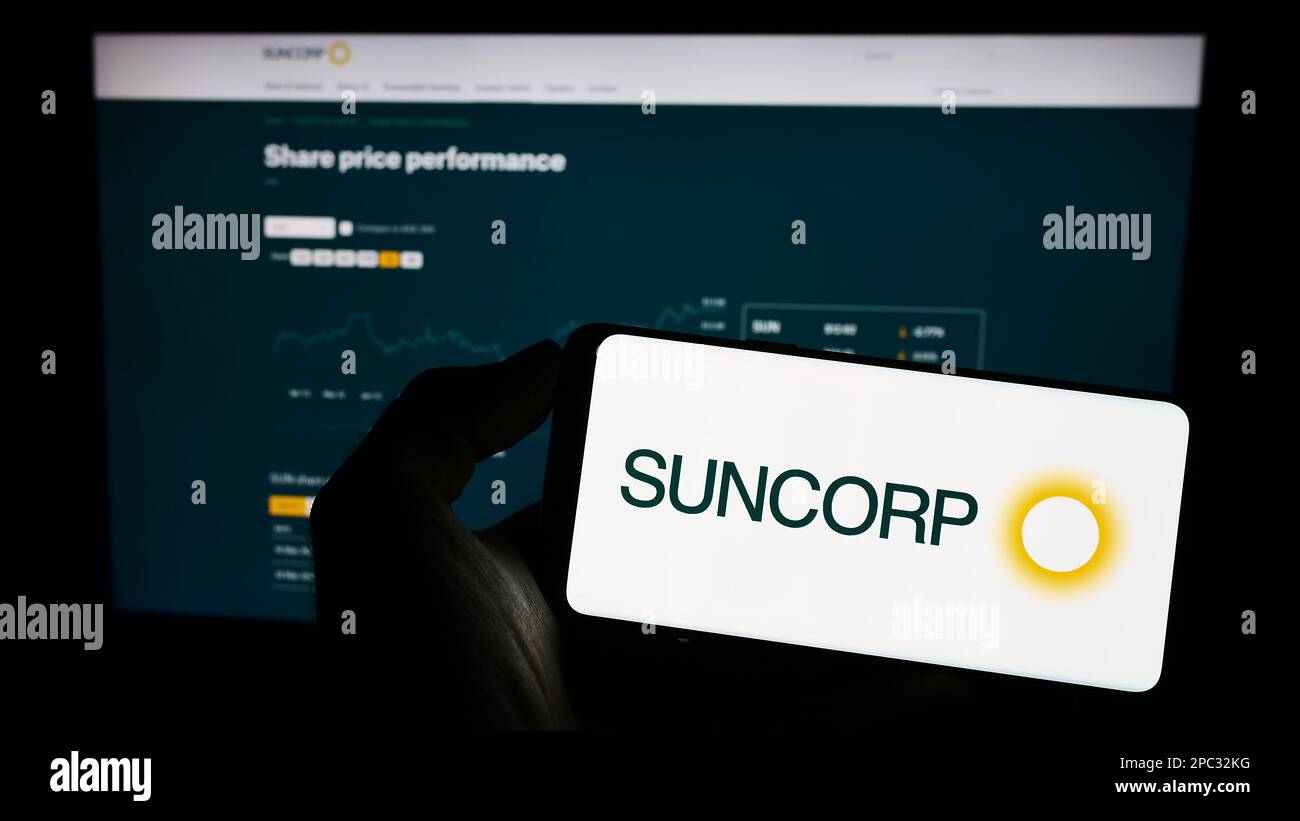 Person holding mobile phone with logo of Australian insurance Suncorp ...
