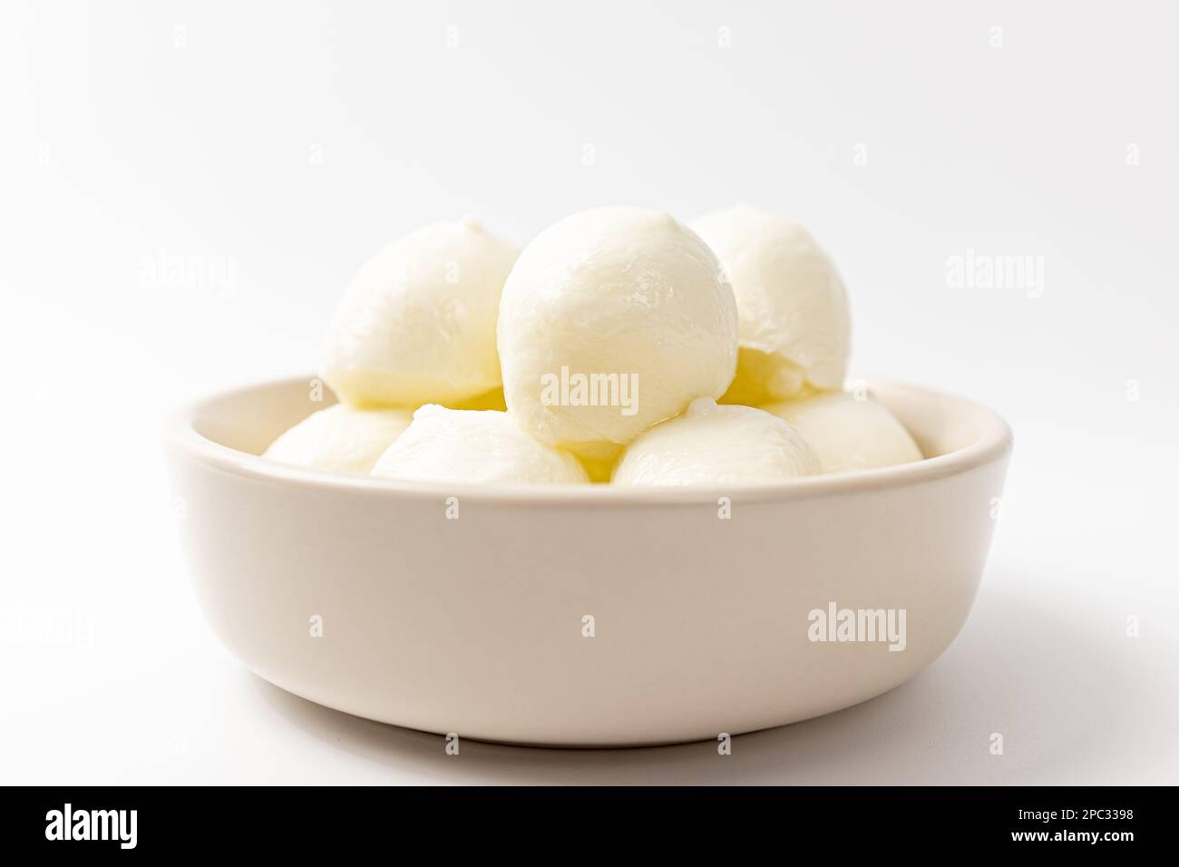 Mozzarella pearls cheese on white background Stock Photo - Alamy