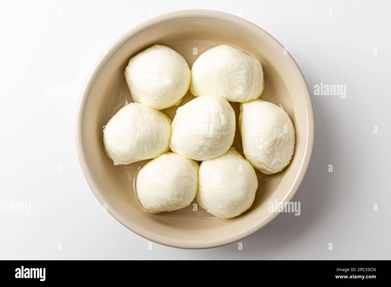 Mozzarella pearls cheese on white background Stock Photo - Alamy